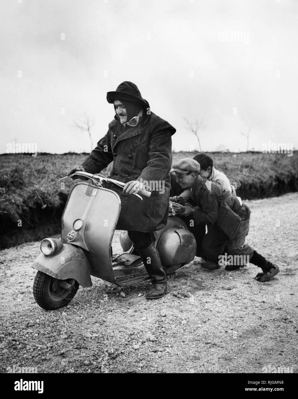 Man driving vespa hi-res stock photography and images - Alamy