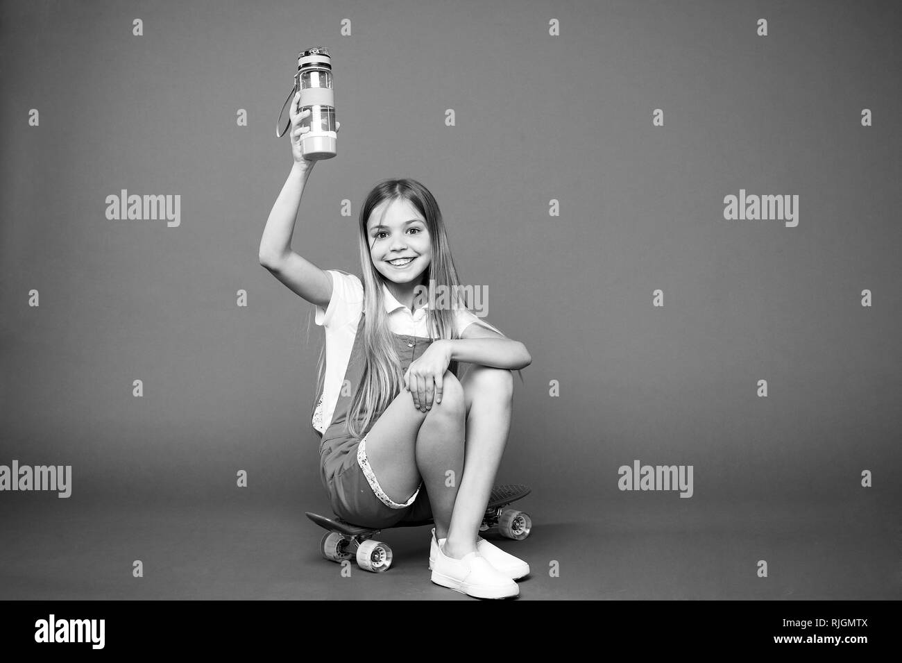 Staying hydrated. Girl happy face holds with water bottle while sit ...