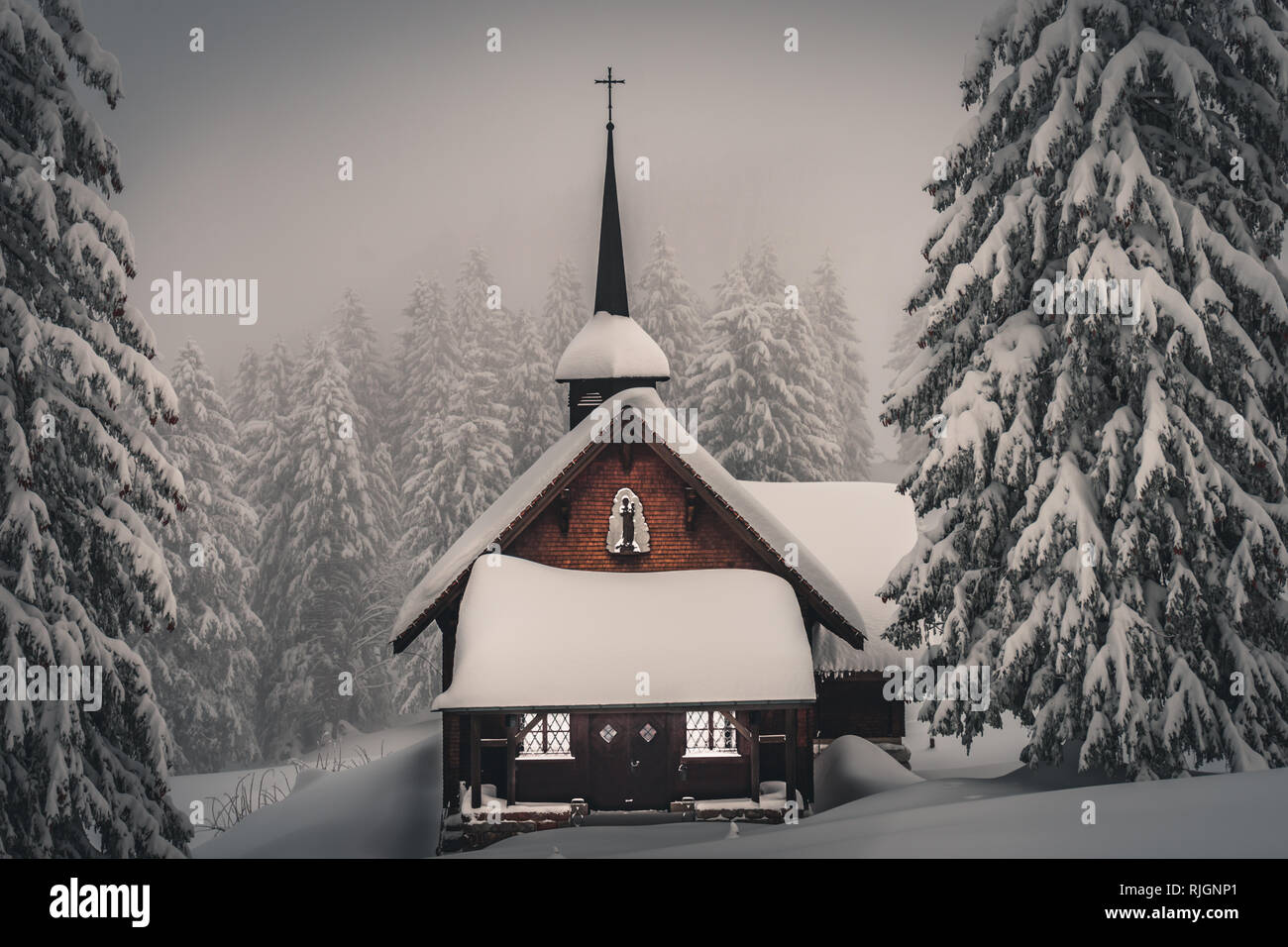 Chapel in the forest in winter hi-res stock photography and images - Alamy