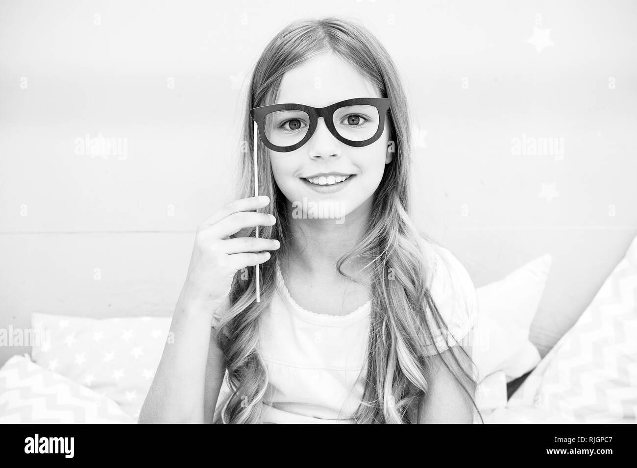 Pajamas party concept. Girl eyeglasses at pajamas party. Cheerful kid ...
