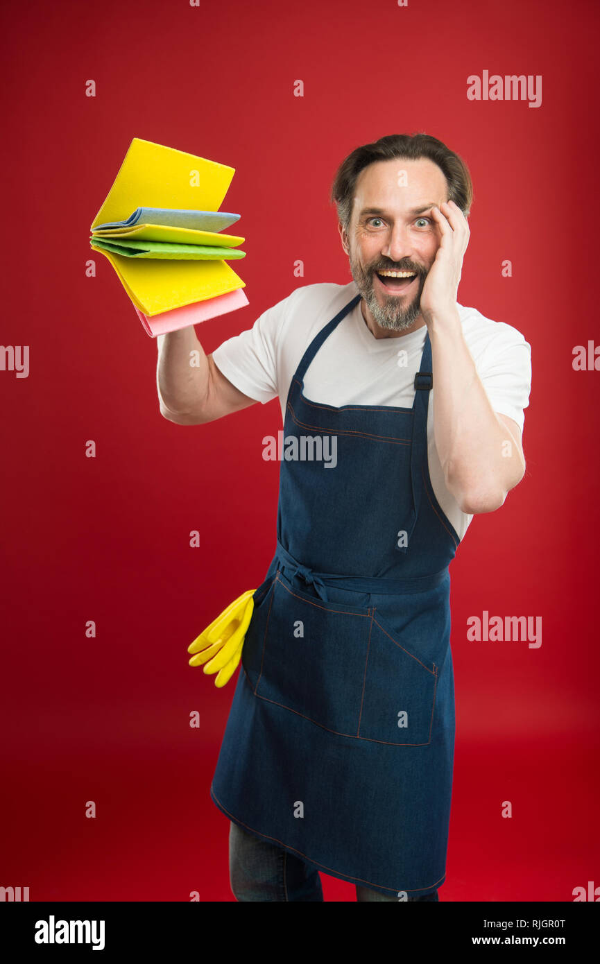 Cleaning service and household duty. Man in apron with gloves hold ...