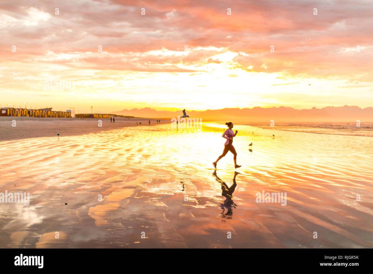 Female runner at sunset hi-res stock photography and images - Alamy