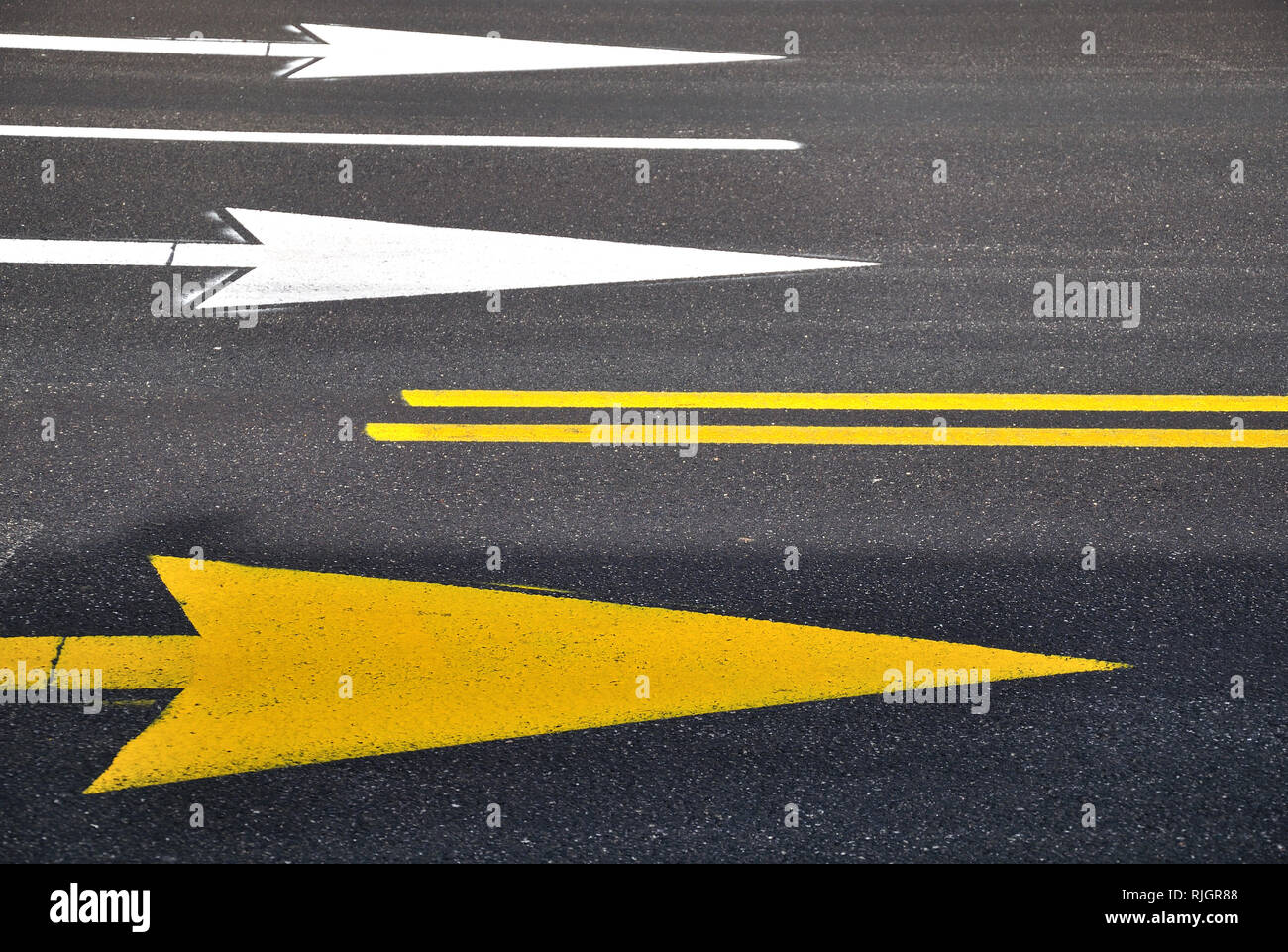 Arrow mark on asphalt , showing the highway traffic direction Stock ...