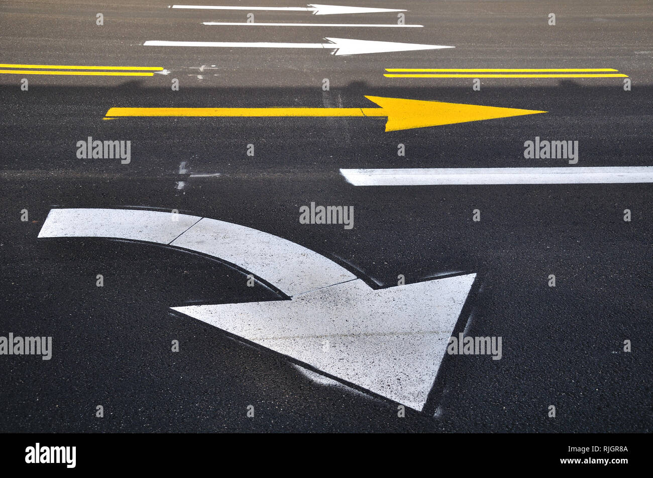 Direction Arrows On Asphalt High Resolution Stock Photography and ...