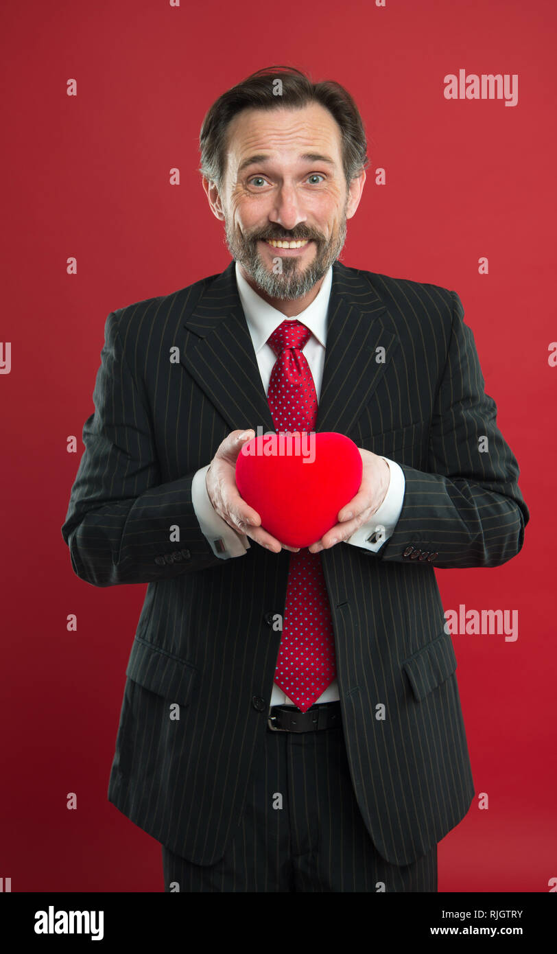 For my sweetheart. Man mature handsome guy wear elegant suit hold red ...