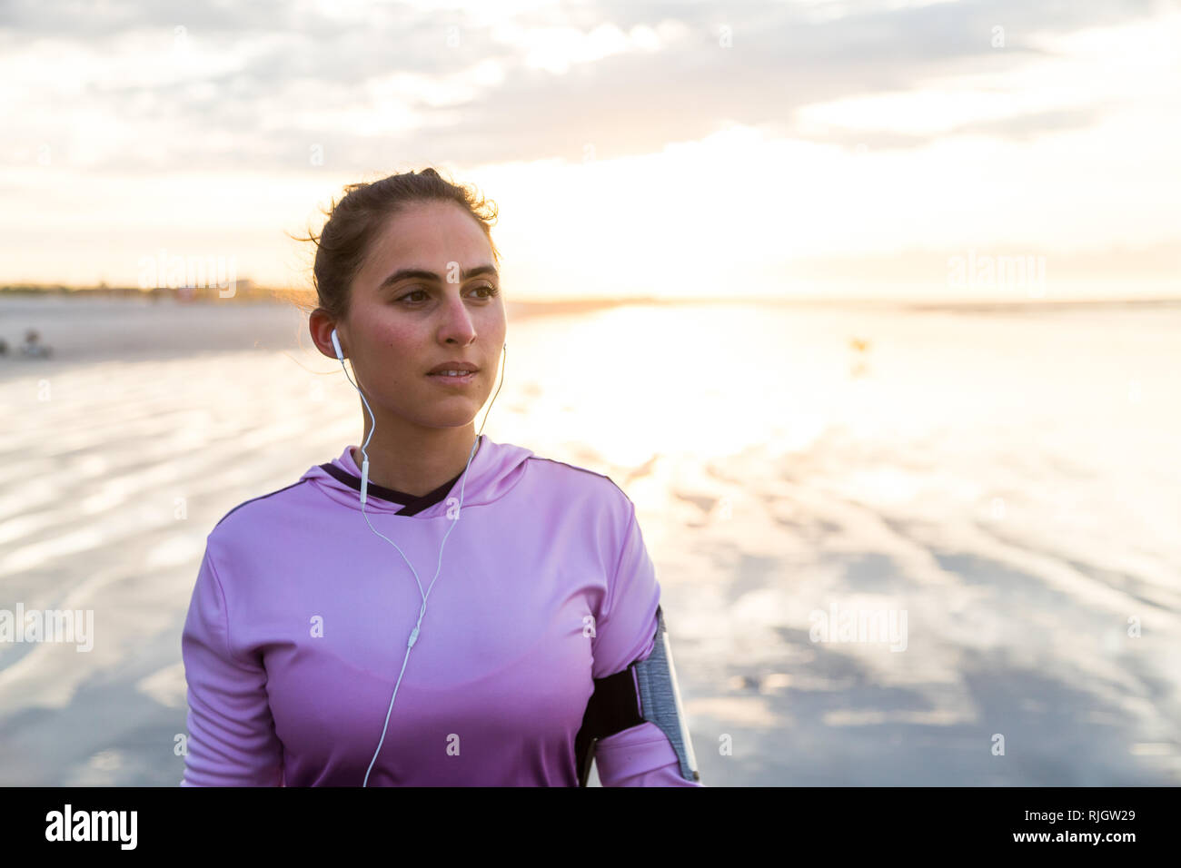 Woman relaxing after jogging sea hi-res stock photography and images ...
