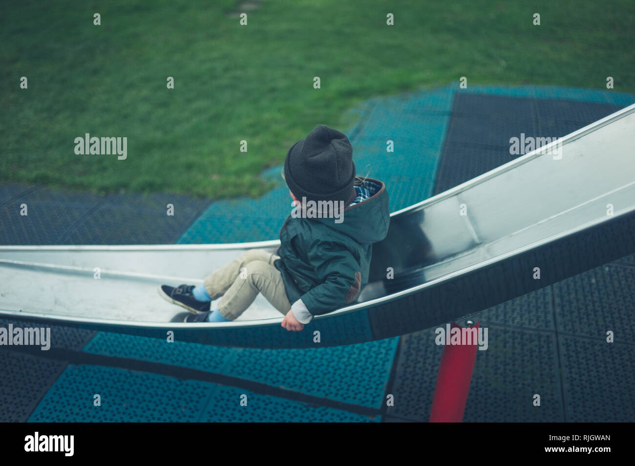Going down the slide hi-res stock photography and images - Alamy