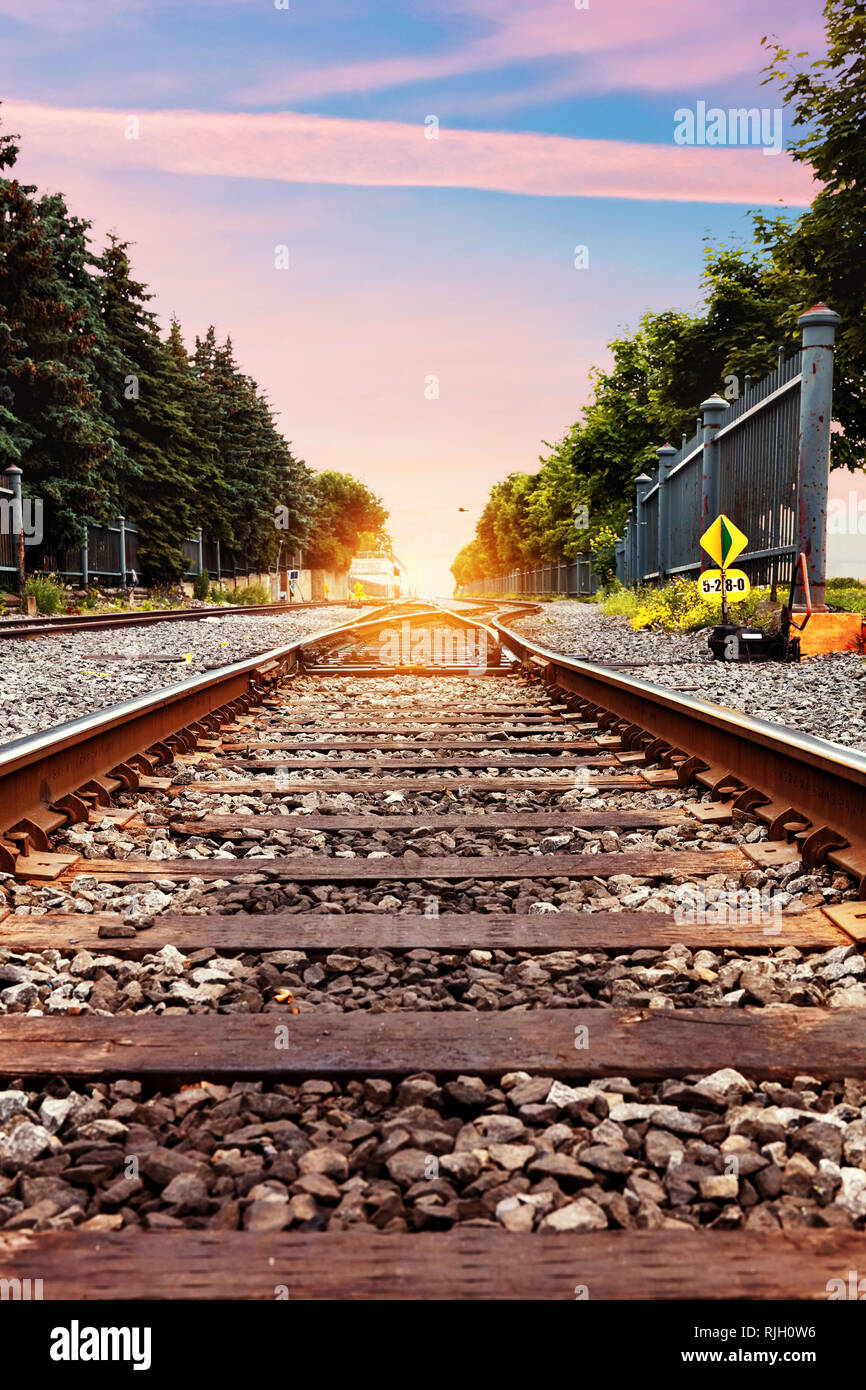 Railroad tracks against beautiful sky at sunset. Industrial landscape ...