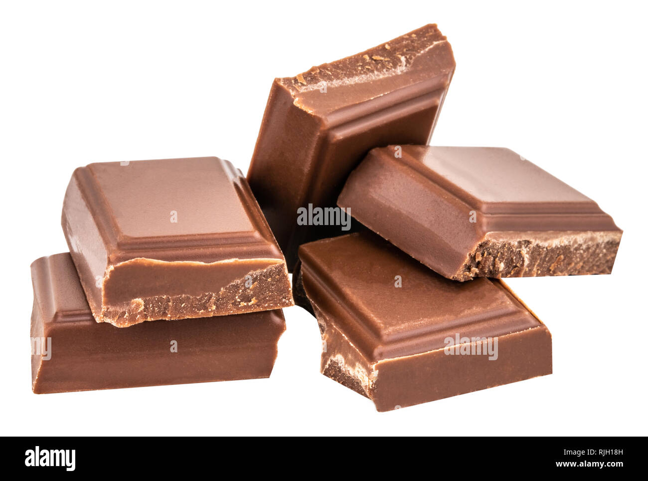 Milk chocolate pieces isolated on white background. With clipping path ...