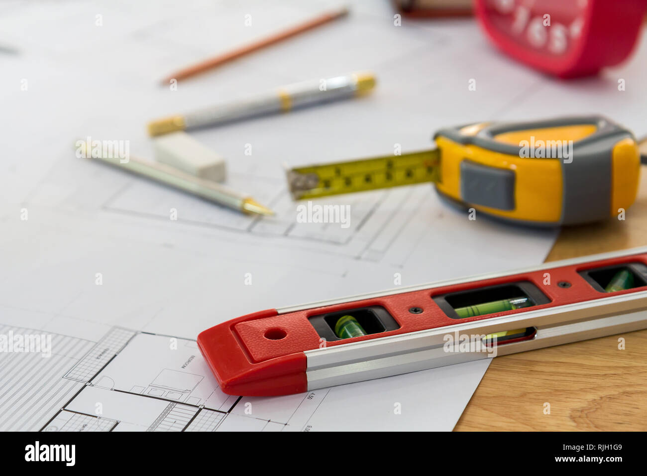 Bubble gauge with measurement tool and pencil on blueprint, architectural concept Stock Photo ...