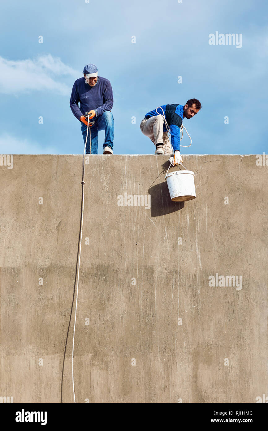Bodrum, Turkey - January 2019: Two Turkish construction workers working ...