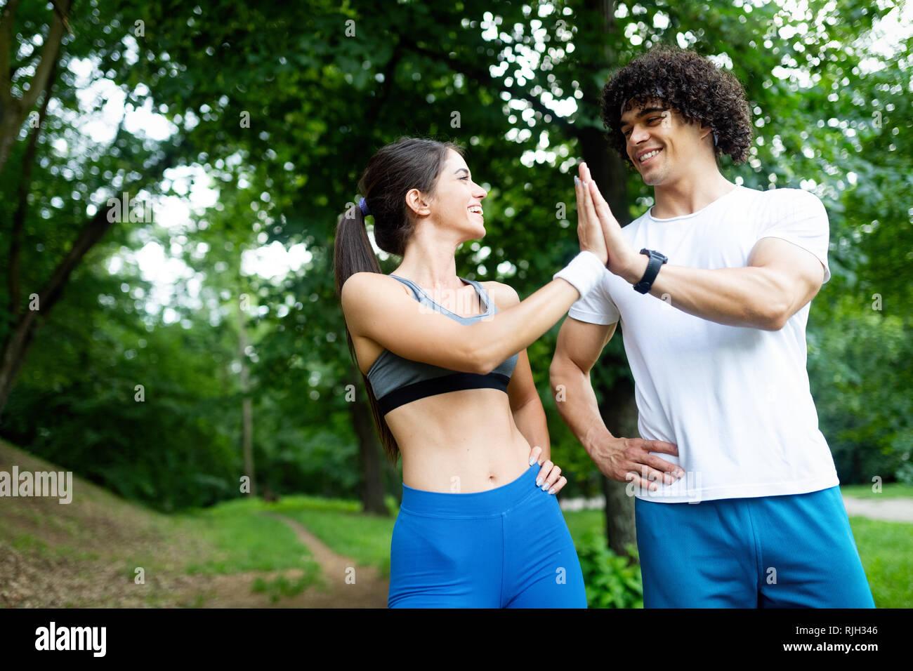 Happy couple running and jogging together outdoor Stock Photo - Alamy