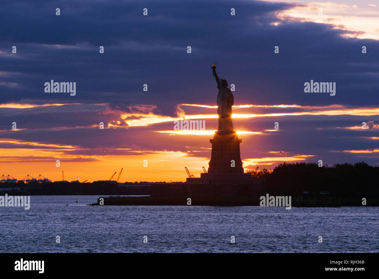 Statue of Liberty at Sunset Stock Photo - Alamy