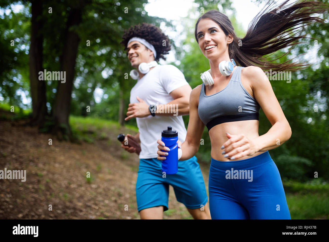 Young happy man jogging in hi-res stock photography and images - Alamy