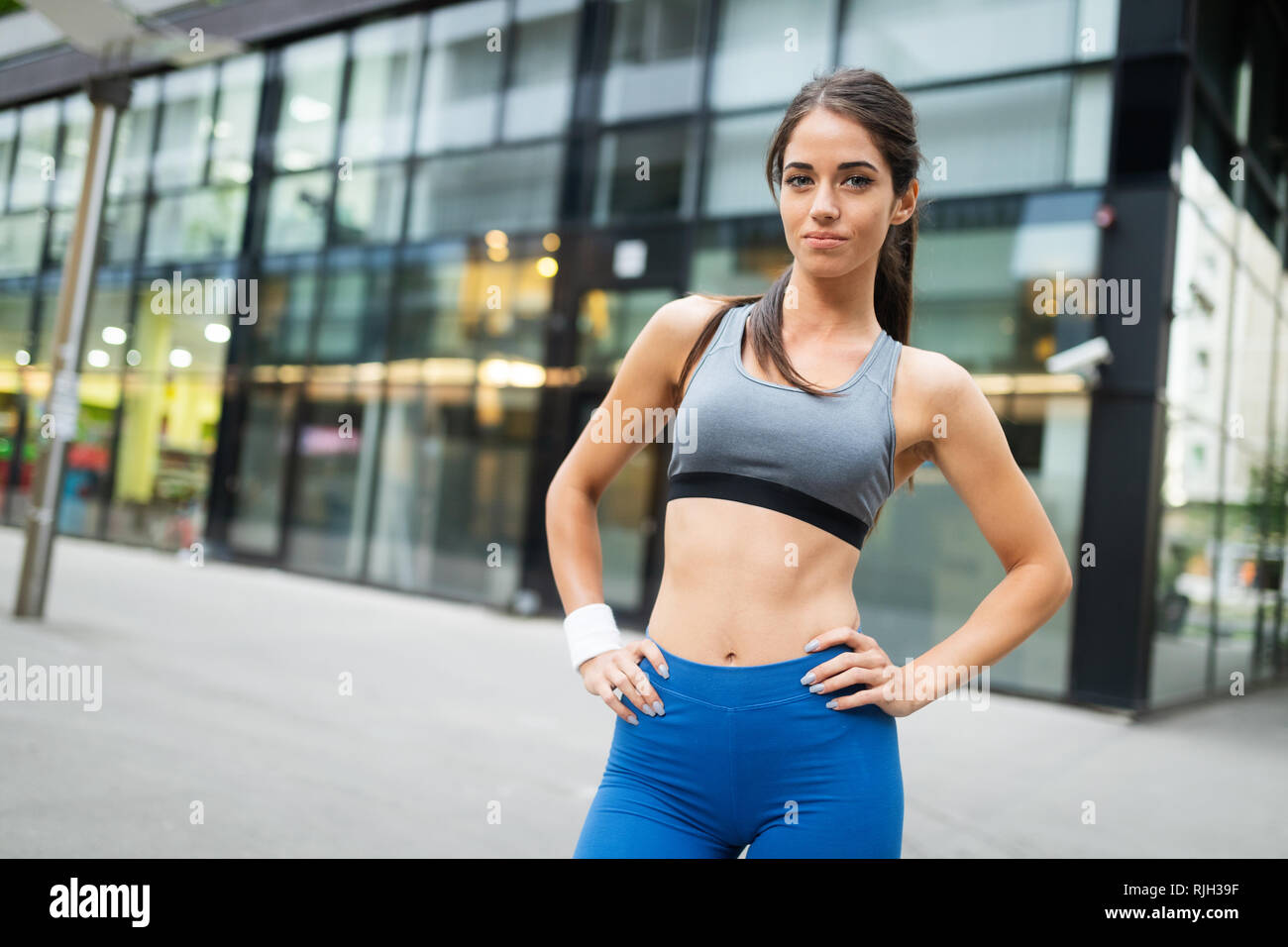 Beautiful happy fit woman running and exercising outdoor Stock Photo ...