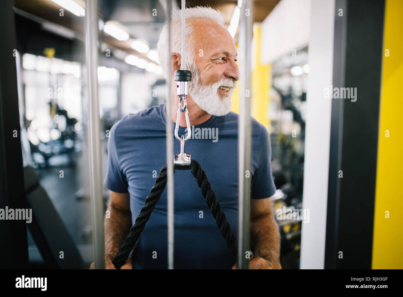 Senior man at the gym doing exercise to stay healthy Stock Photo - Alamy