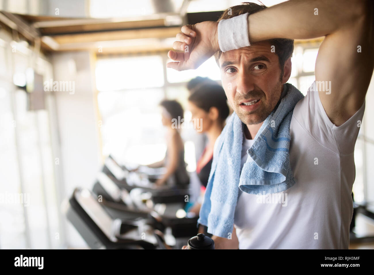 Man training on running machine hi-res stock photography and images - Alamy