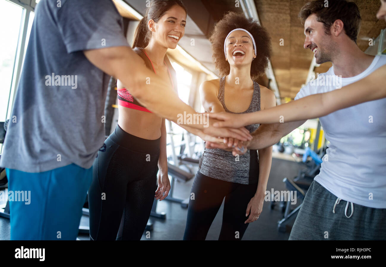 Group of young people doing exercises in gym Stock Photo - Alamy