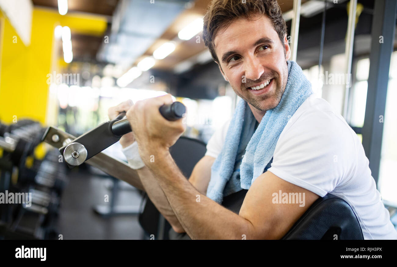 Lifestyle portrait of handsome muscular man after the training in the ...