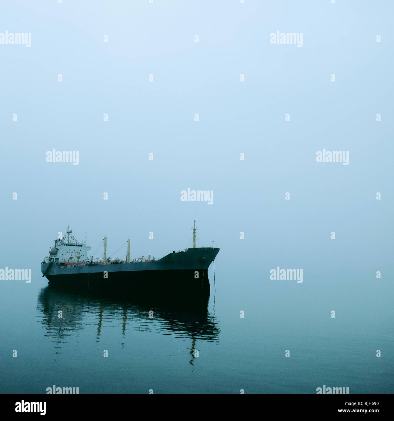 Cargo Ship in Fog Stock Photo - Alamy