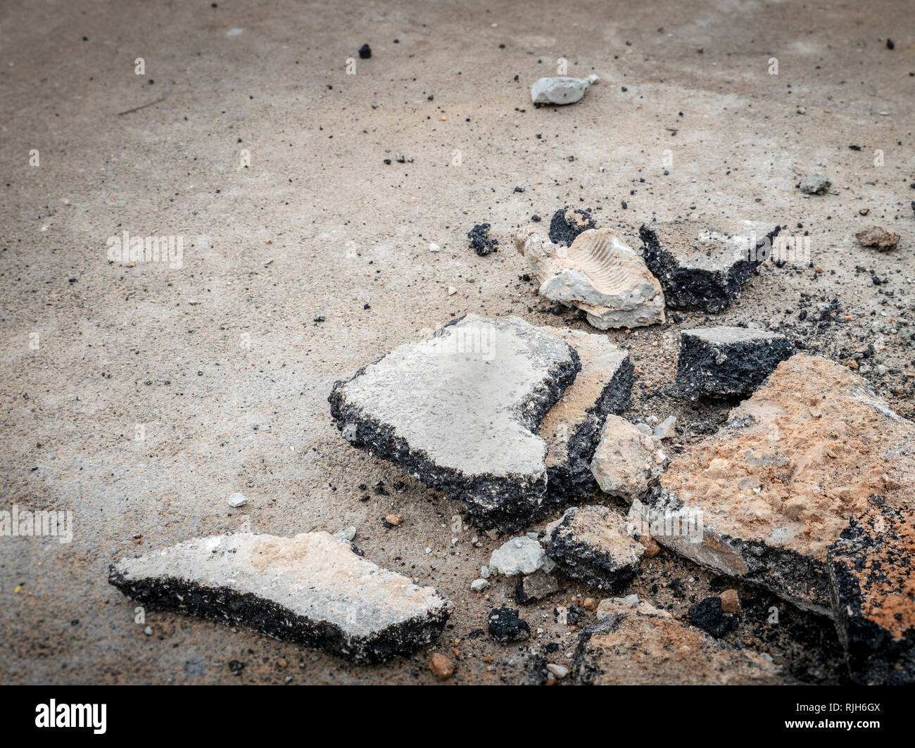 Destroyed asphalt road as a result of an earthquake with fractures of ...