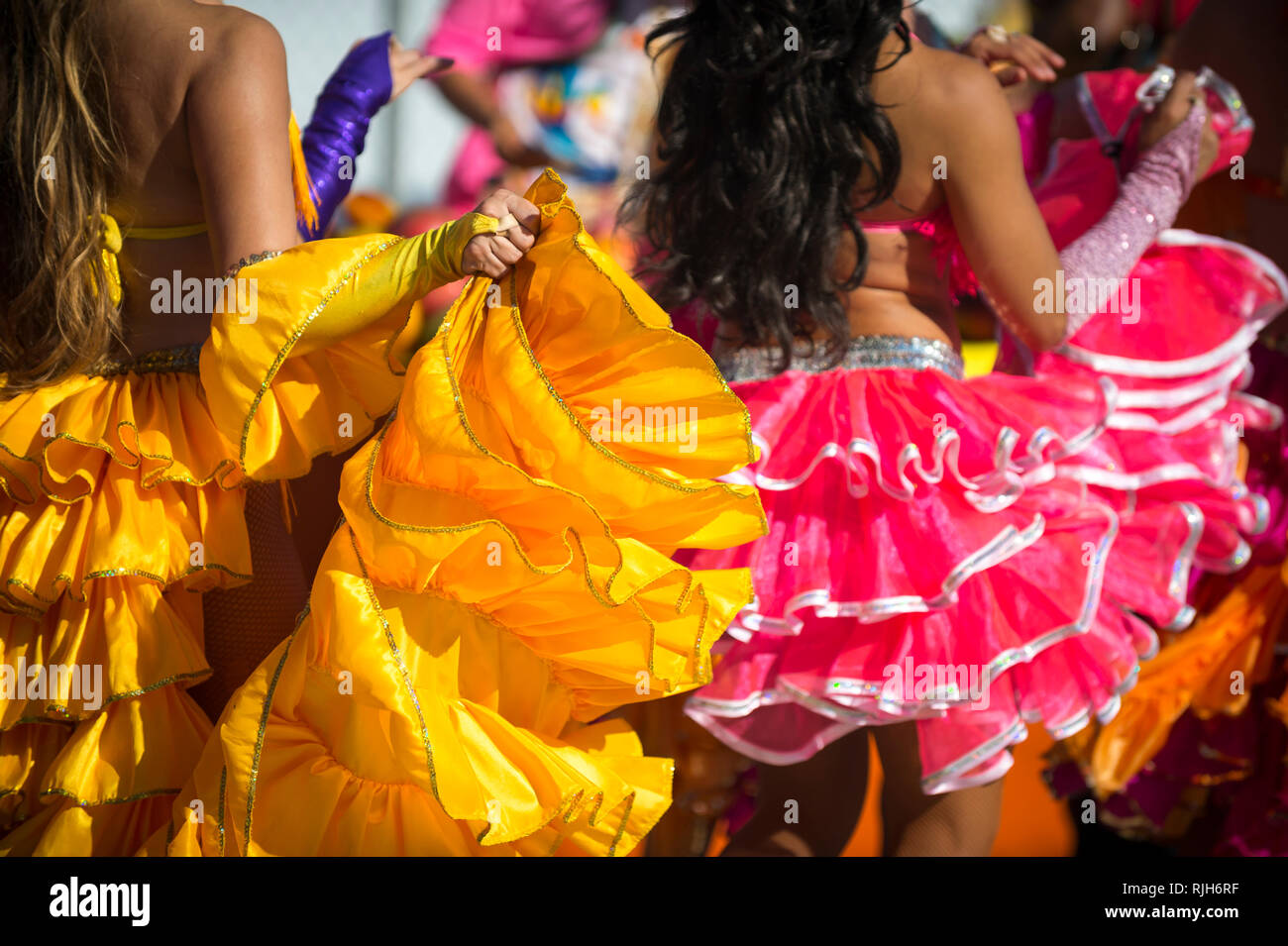 Sunny close-up of the colorful ruffled dresses of Carnival costumes ...