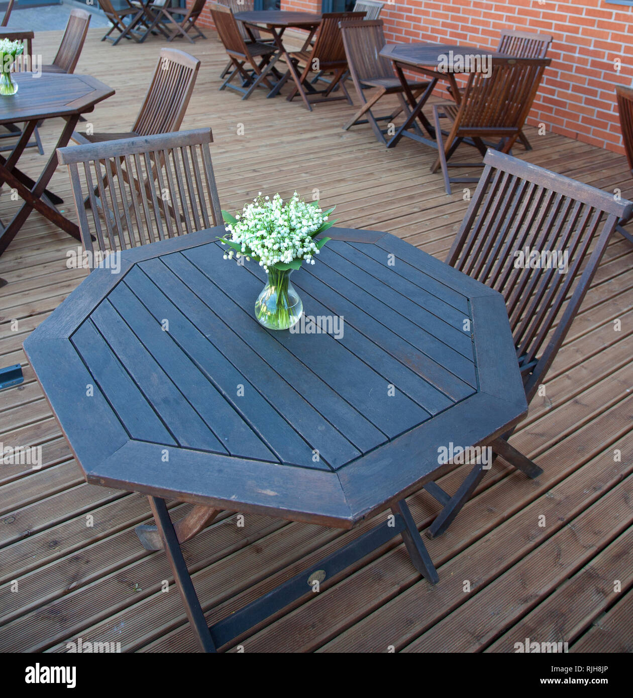 Dining Tables on an Outdoor Deck Stock Photo - Alamy