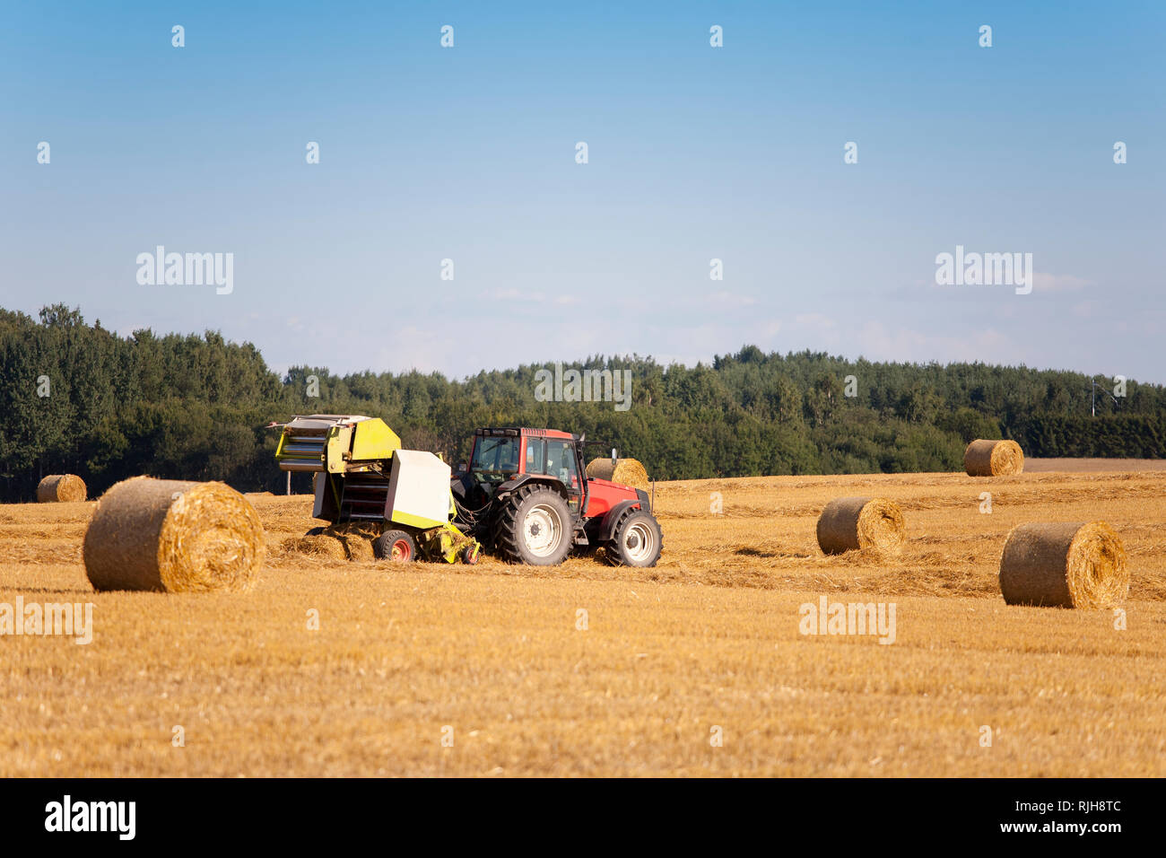 Tractor Harvesting Hay Stock Photo - Alamy