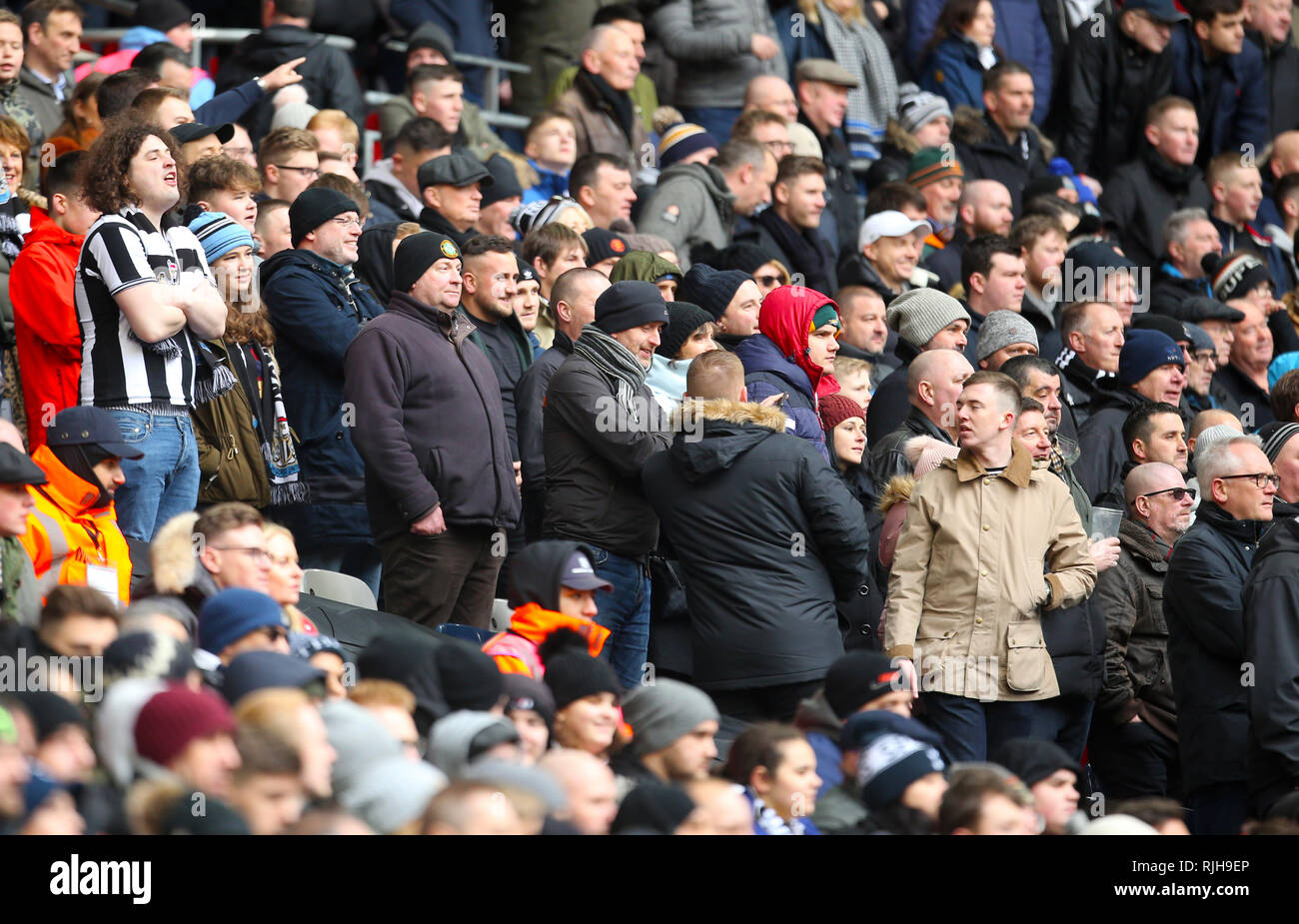 Newcastle United fans in the stands Stock Photo - Alamy