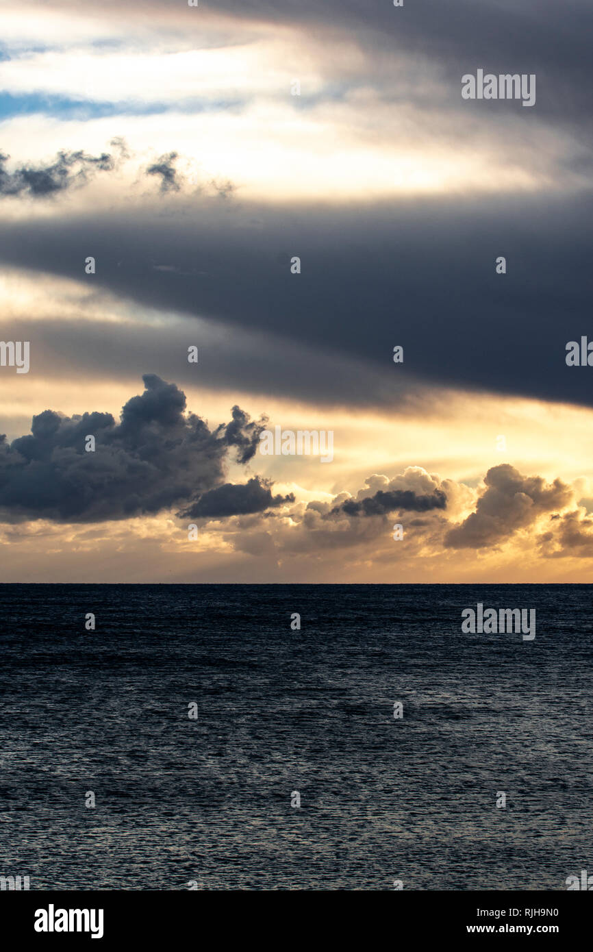 Moody Seascape capturing the Sunset over Long Rock - Cornwall Stock ...