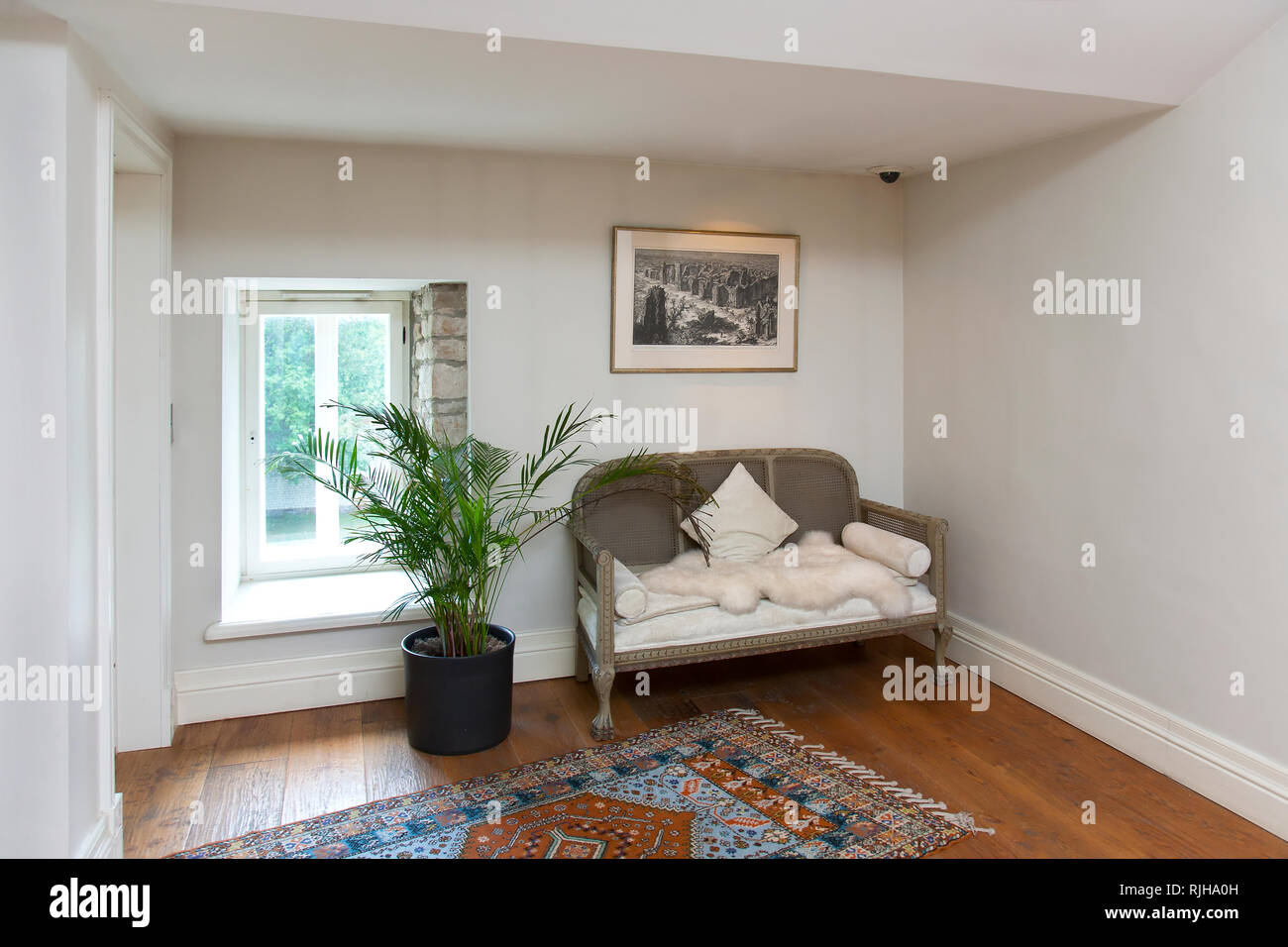 Small Sofa in a Sparse Room Stock Photo - Alamy