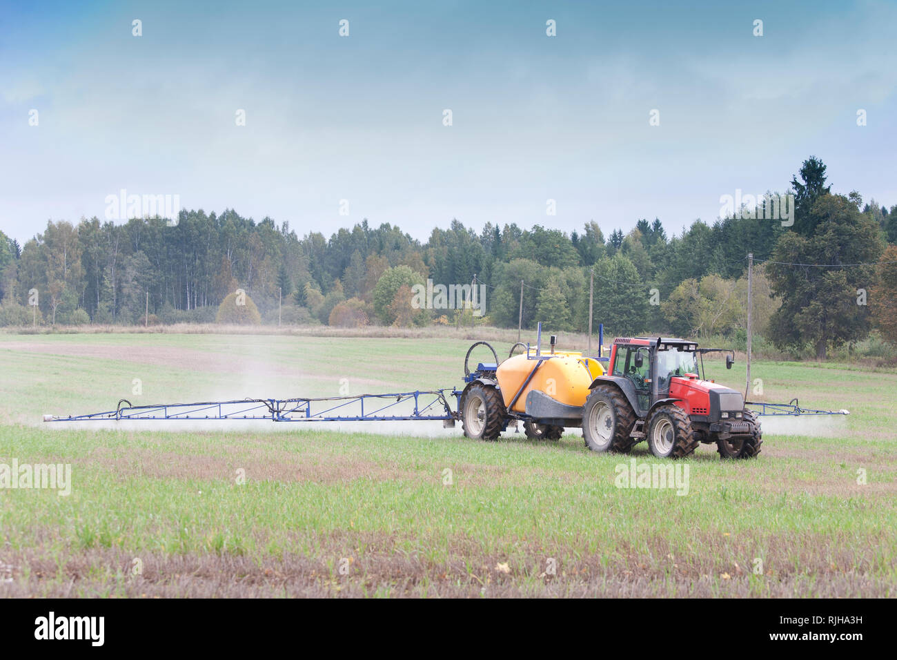 Tractor Spraying Herbicide Stock Photo - Alamy