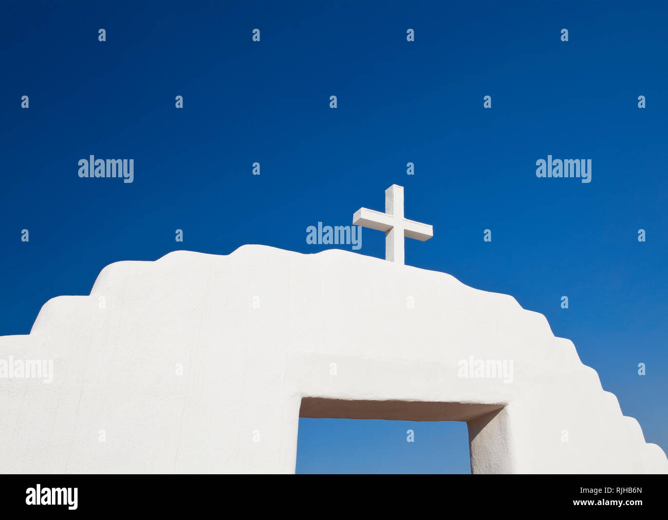 Cross On An Archway Stock Photo - Alamy