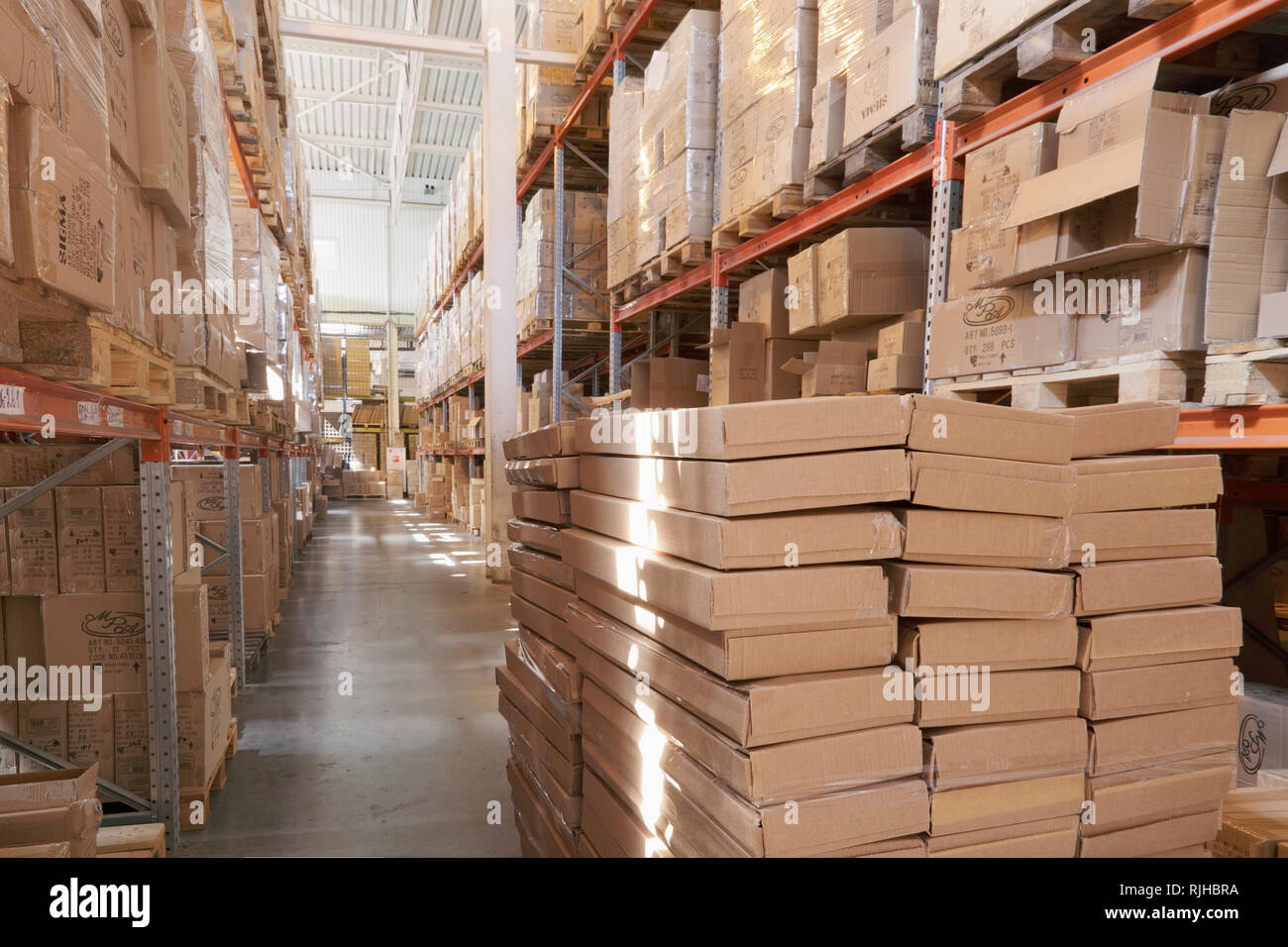 Cardboard boxes in warehouse Stock Photo - Alamy