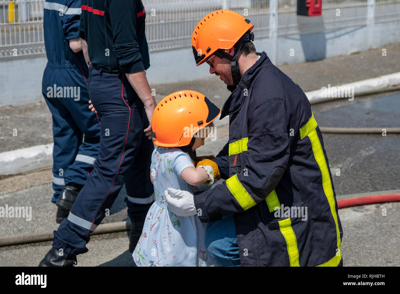Fire uniformed father teaches his daughter Firefighter Stock Photo - Alamy