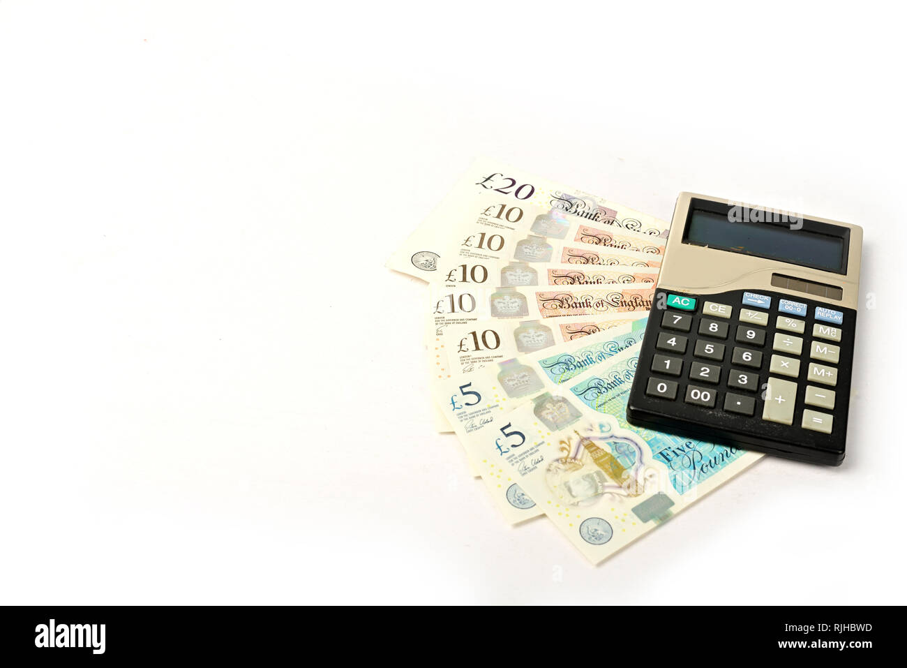 Pound paper money and calculator are isolated on white background Stock ...