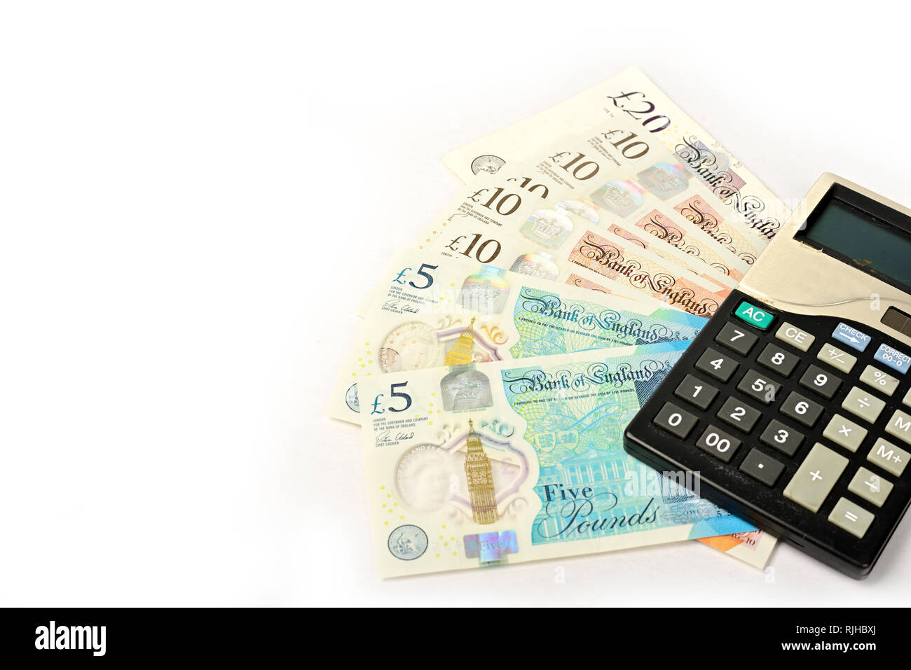 Pound paper money and calculator are isolated on white background Stock ...