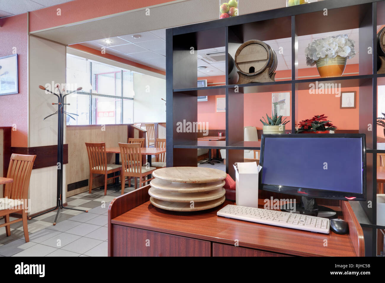 Computer at hostess station in restaurant Stock Photo - Alamy