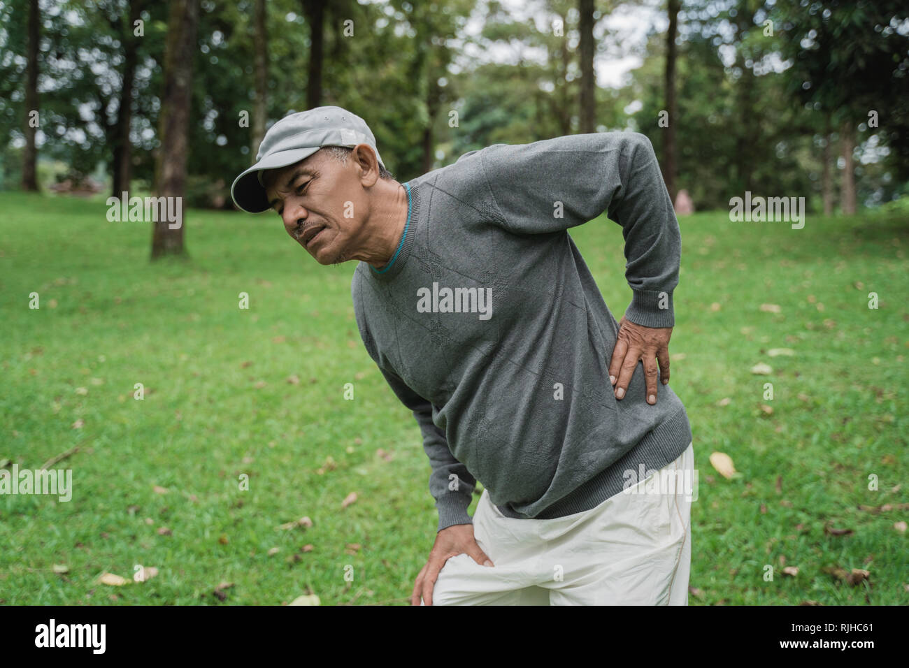 asian senior old man having back pain Stock Photo - Alamy