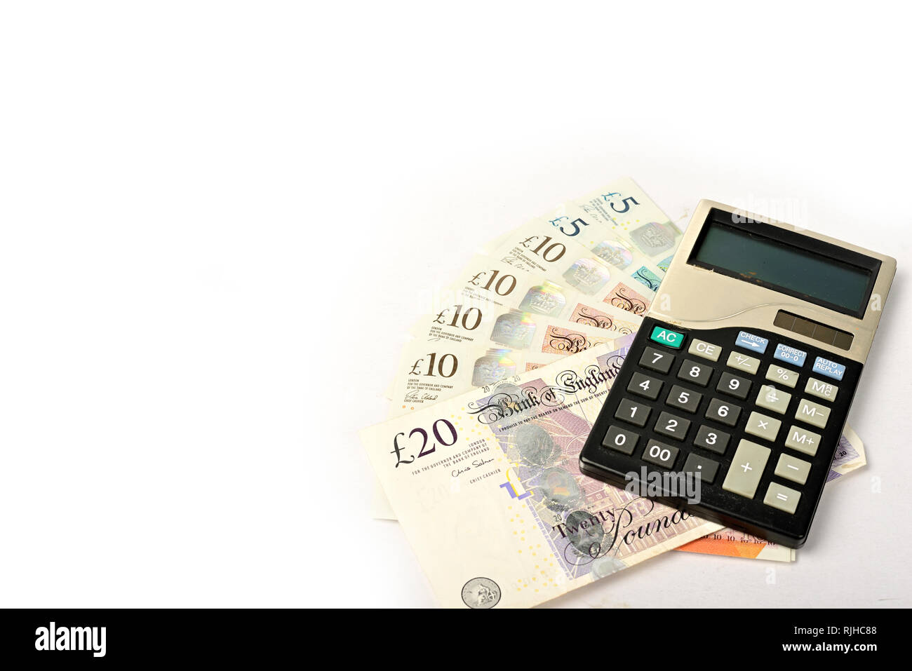 Pound paper money and calculator are isolated on white background Stock ...