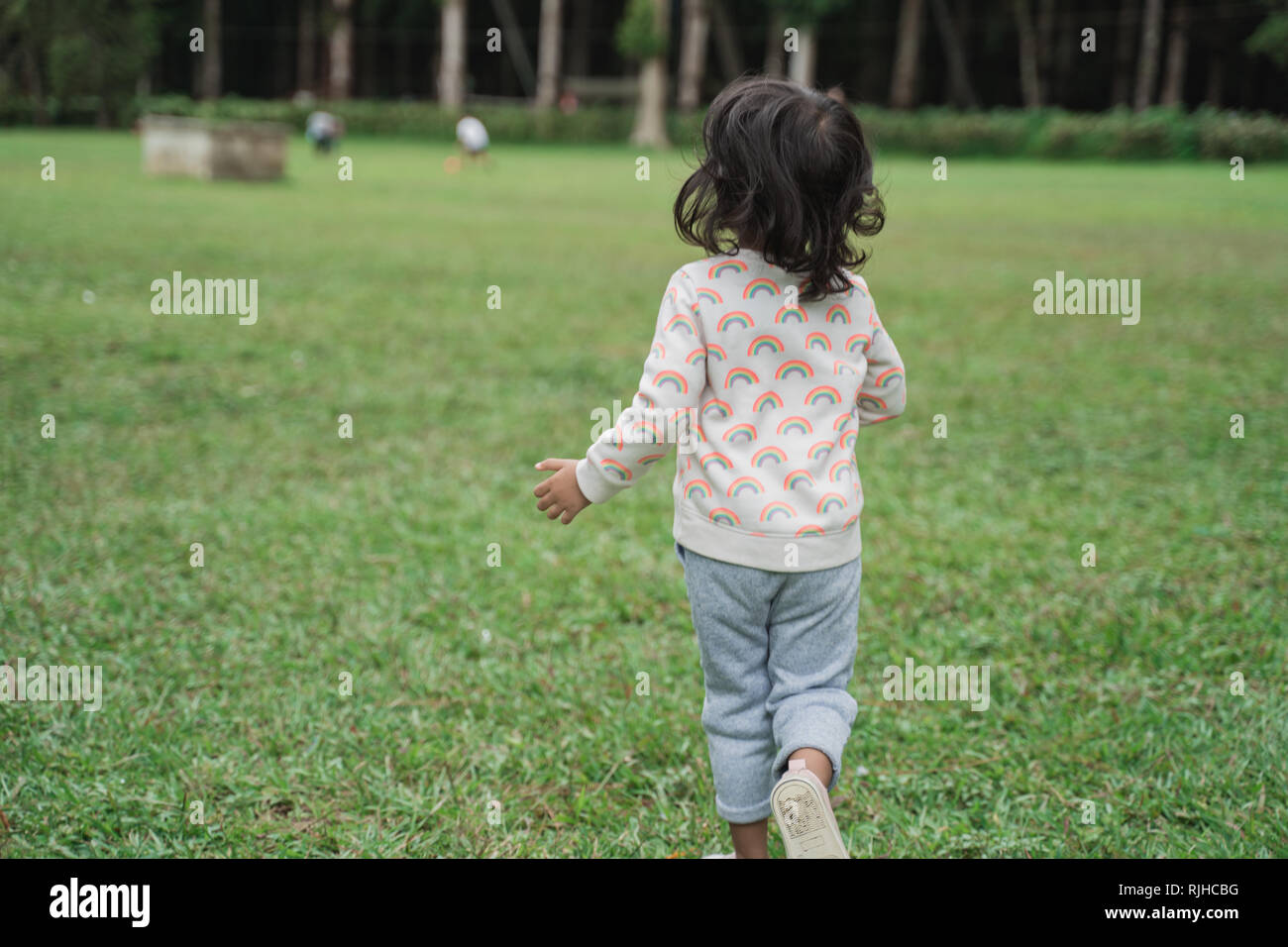 Little girl running behind little hi-res stock photography and images ...