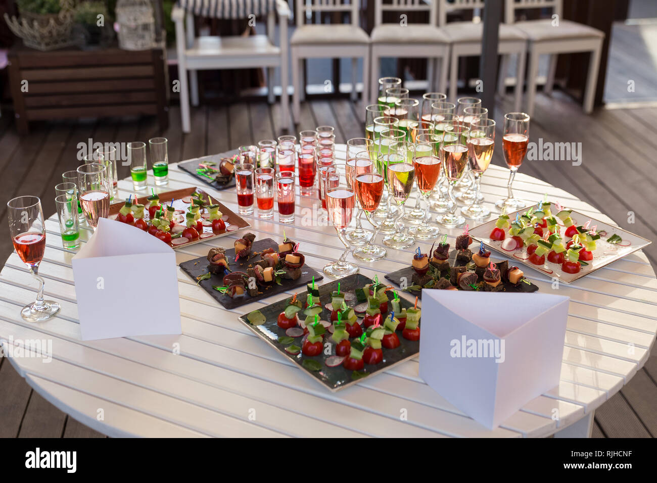 catering services background with snacks and colorful drinks on white ...