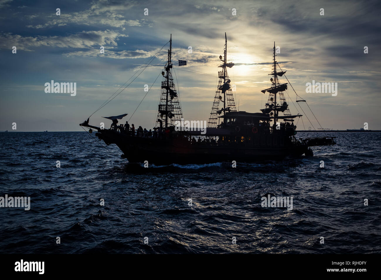 Fake pirate cruise ship for tourists during sunset in the harbour in ...