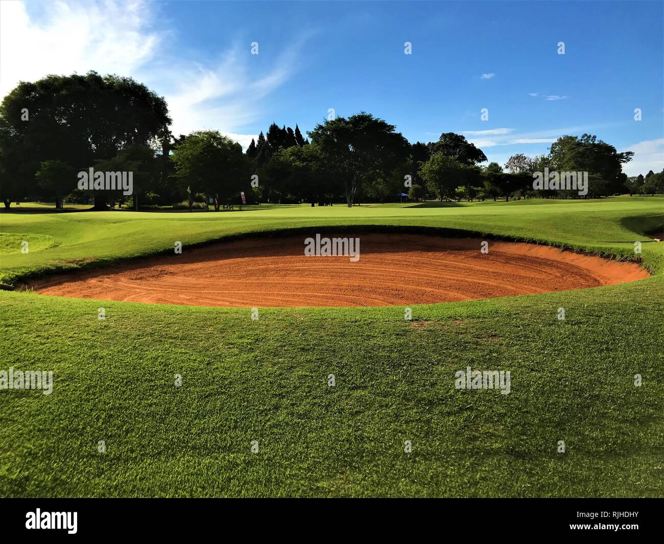 Golf course sand bunker beautiful day Stock Photo - Alamy