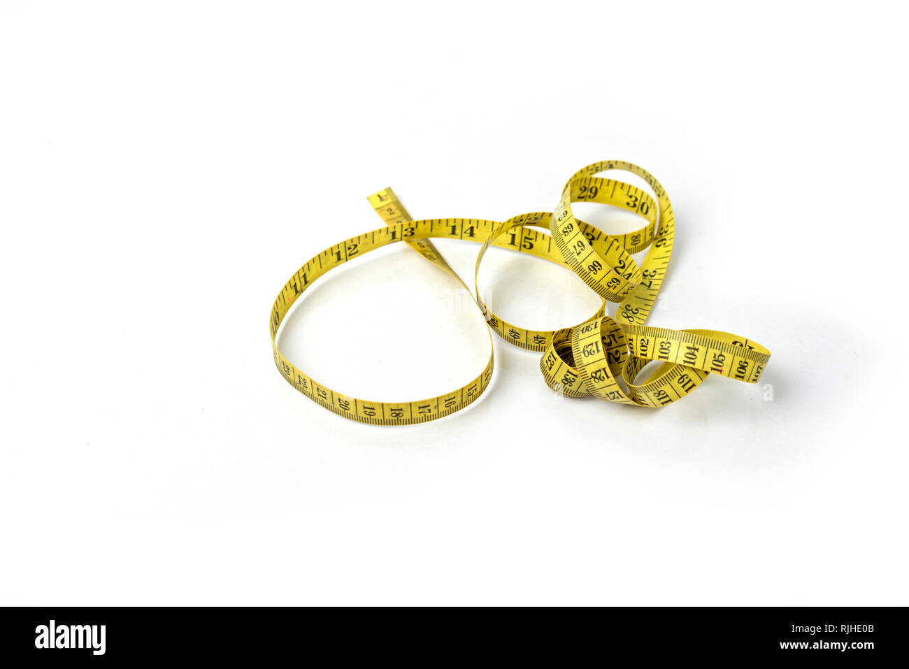 Measuring tape isolated on white background Stock Photo - Alamy