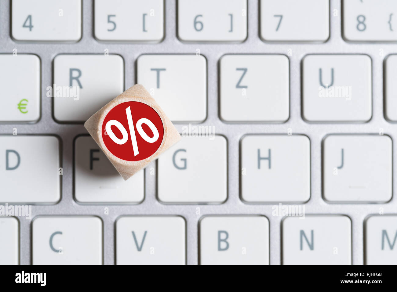 cube with percent symbol and a computer keyboard Stock Photo - Alamy