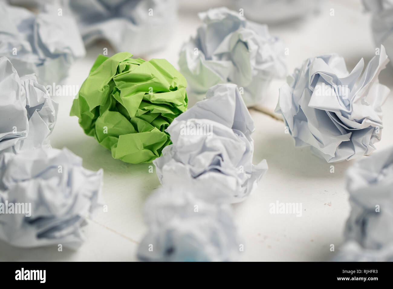 crumpled paper symbolizing different solutions with one standing out ...
