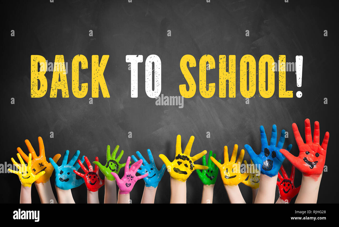 many painted kids hands with smileys and the message "back to school ...
