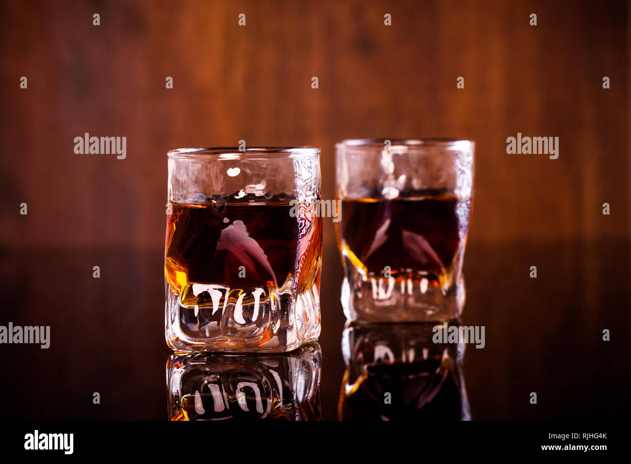 two shots of rum Stock Photo - Alamy