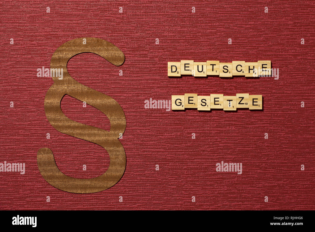 The sign paragraph on the claret color background. Its on the table ...